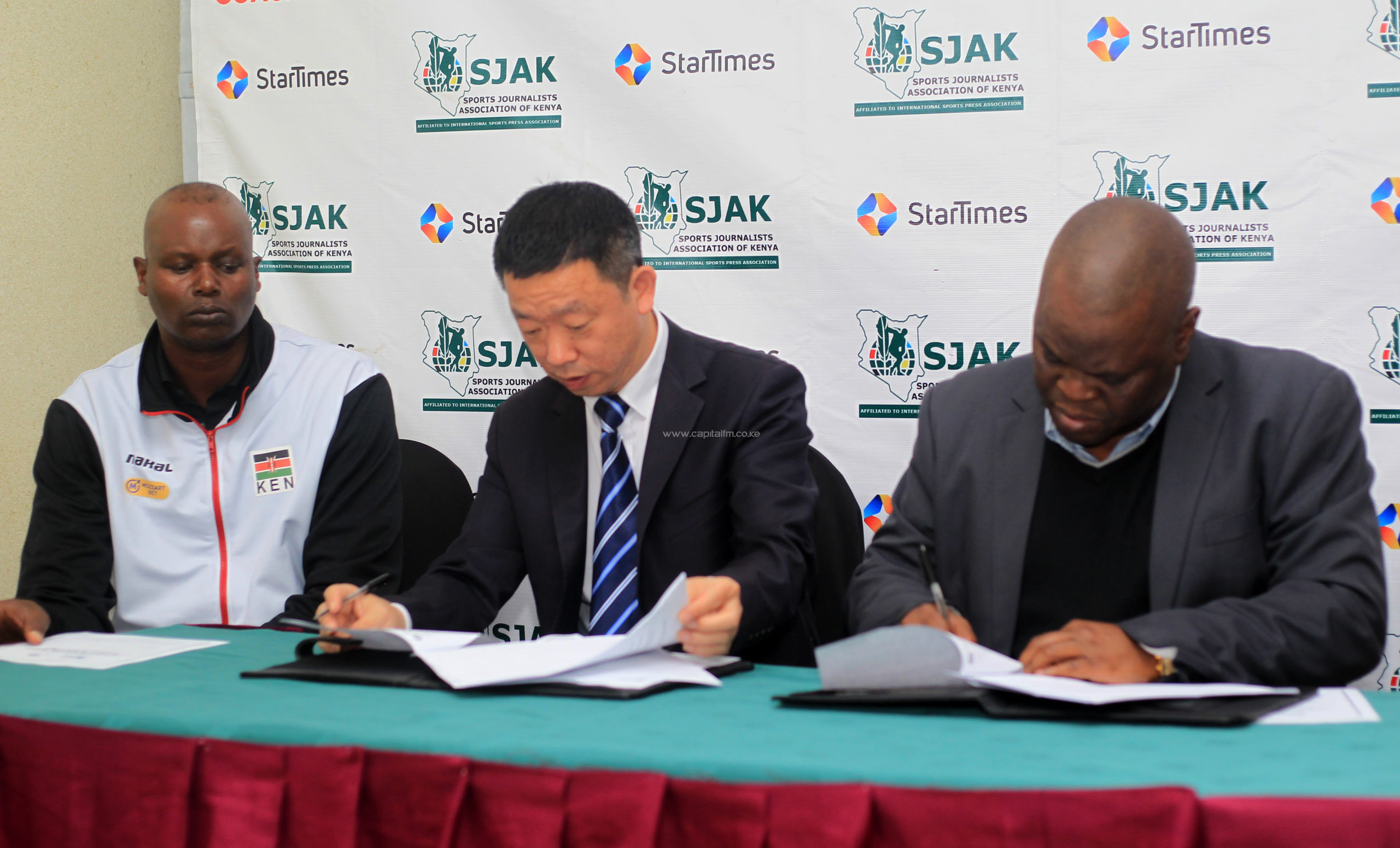 Paul Bitok witness signing of Startimes and SJAK Caps - Capital Sports