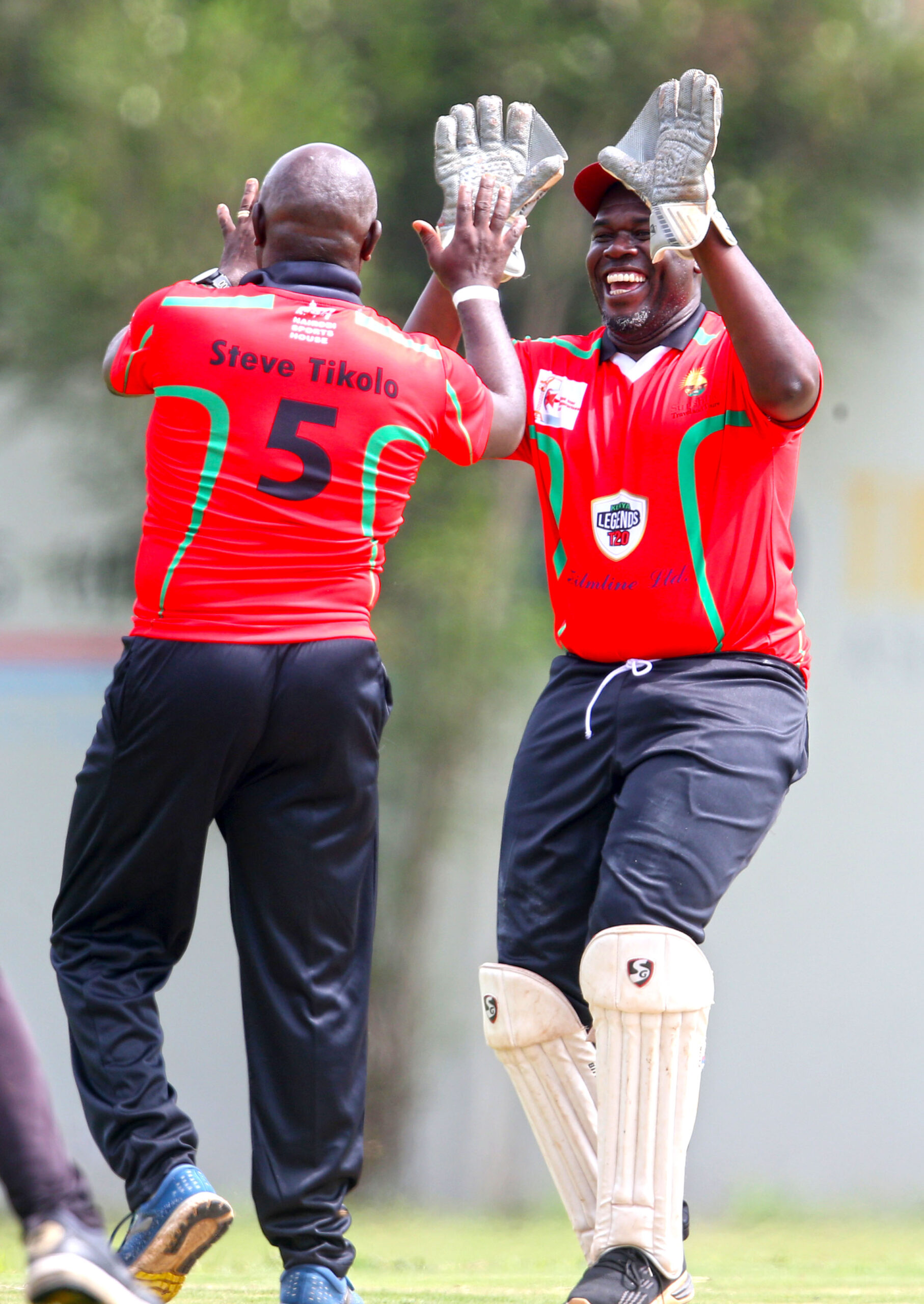 Team Red David Obuya and Captain Steve Tikolo celebrates a wicket Caps ...